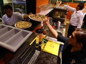 Coffee and pizza: a slice of life in troubled Libya