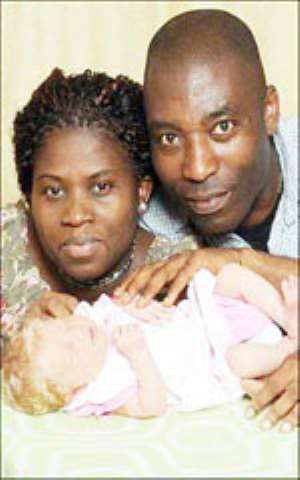 Reactions trail birth of white baby by Nigerian couple