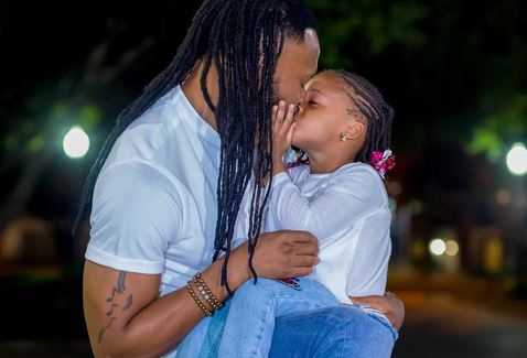Singer, Flavour Nabania under Fire for Kissing Daughter