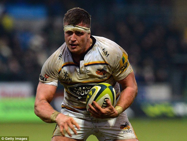 Rugby player suffers spinal injury after diving into swimming pool