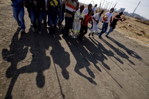 200 workers march at S.Africa's Marikana mine