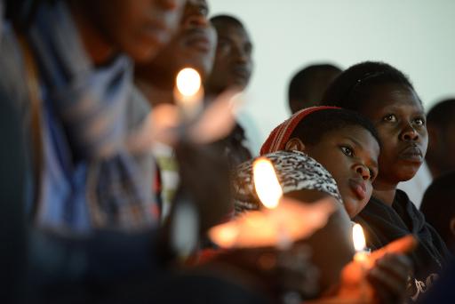 Candle flames in Rwanda mark mourning of genocide
