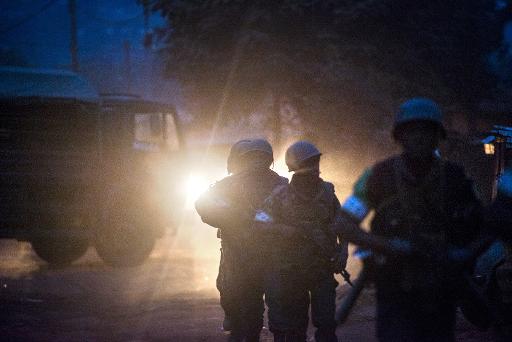 Militia fighters clash in Bangui as thousands march for peace