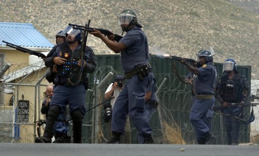South African police shoot at striking farm workers