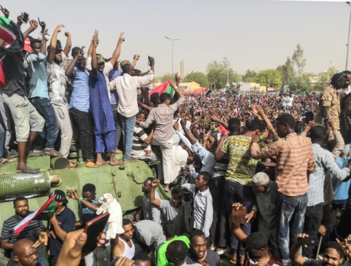 Jubilant Sudanese shout 'regime has fallen' as they wait on army