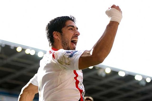 Diego Forlan says Luis Suarez is happy at Premier League side Liverpool