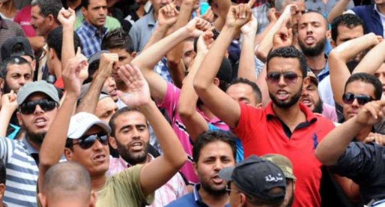Tunisia feminist on trial, topless protesters held