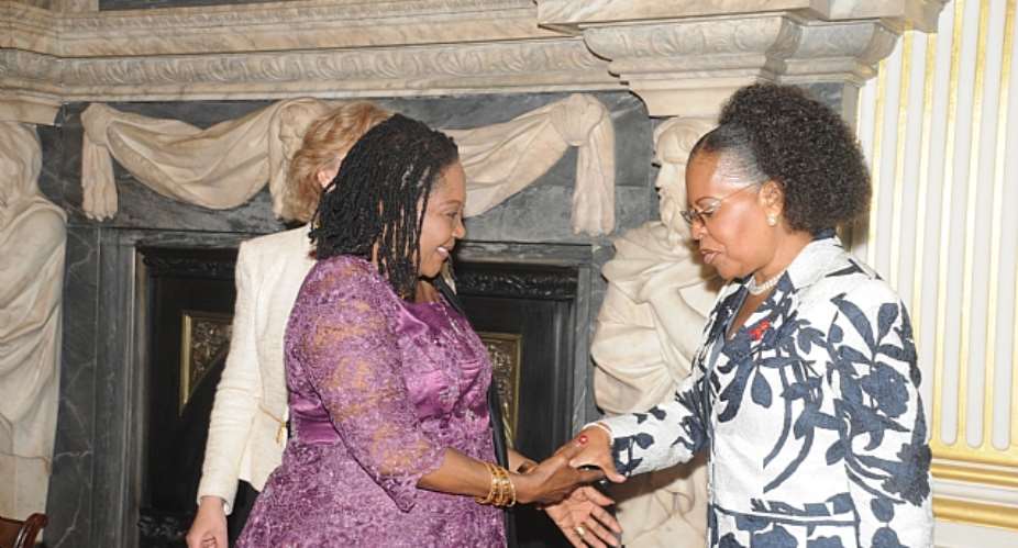 First Lady Interacts with Baroness Northover in London
